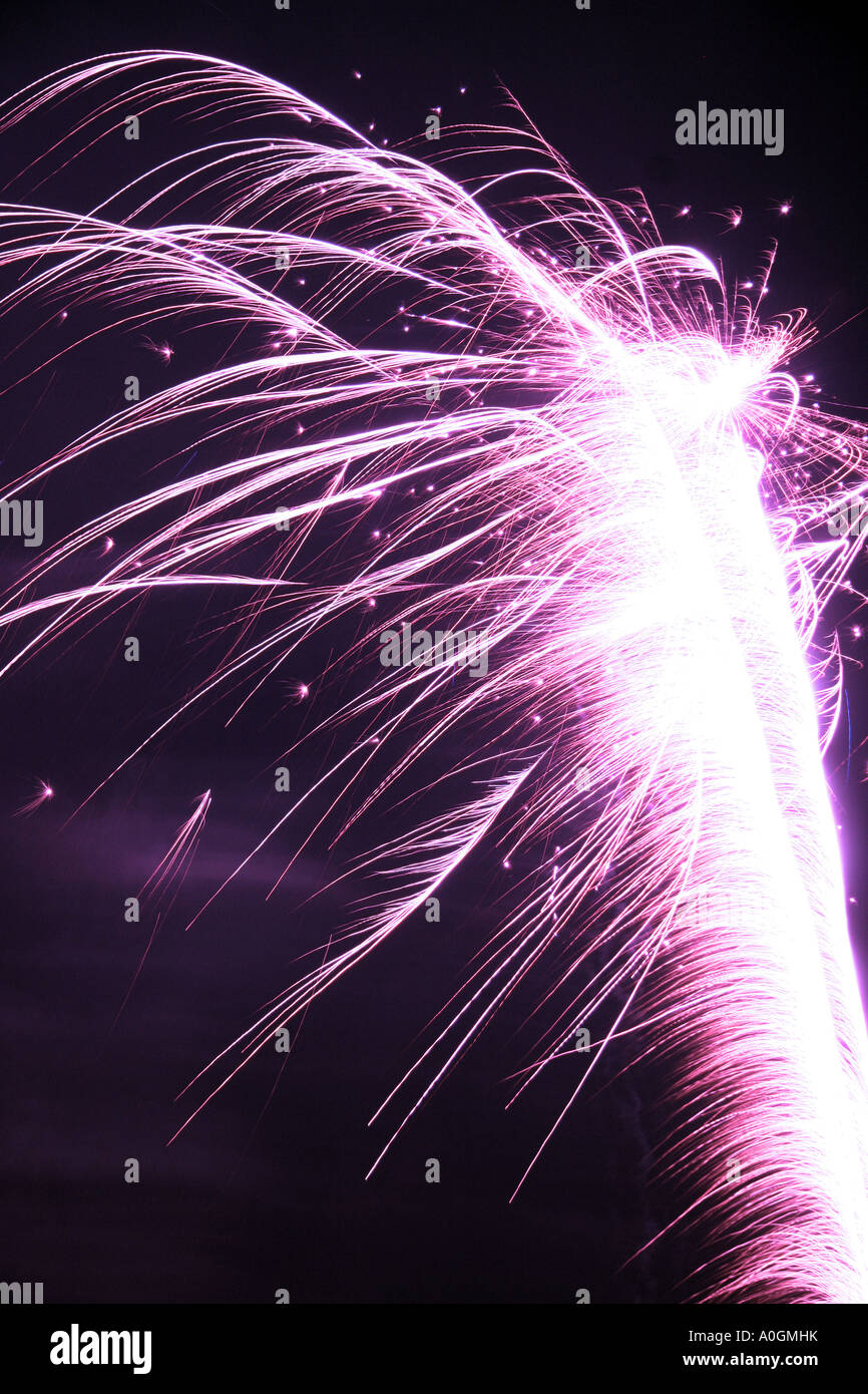 Pink sparks from a rocket on fireworks night Stock Photo - Alamy