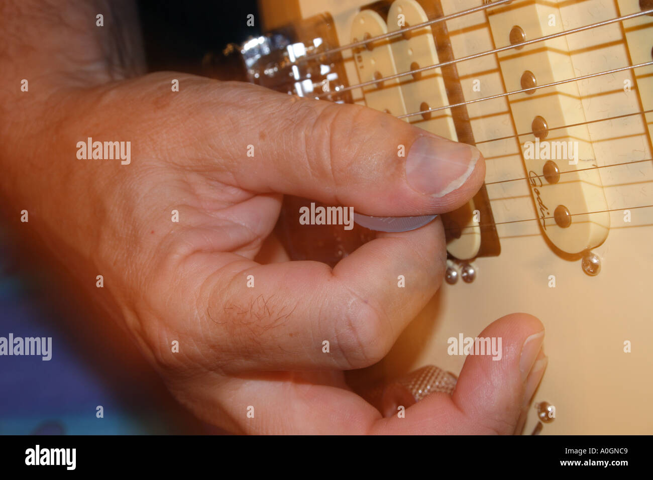 A CLOSE UP PHOTO OF A ELECTRIC GUITAR BEING PLAYED Stock Photo - Alamy
