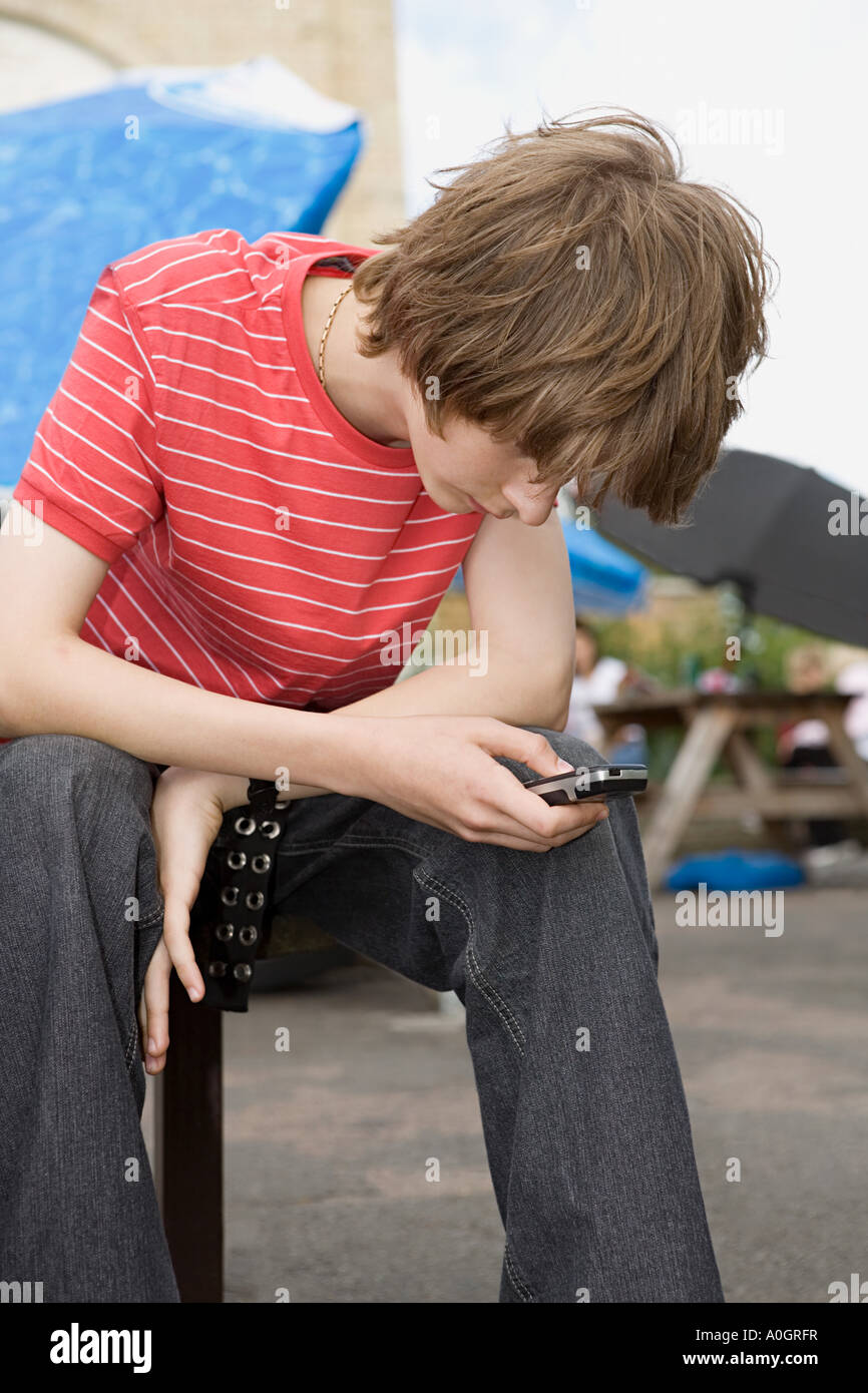 Teenage boy with cellphone Stock Photo - Alamy
