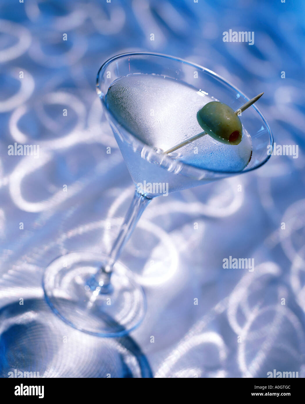 Green olive in a martini glass Stock Photo - Alamy