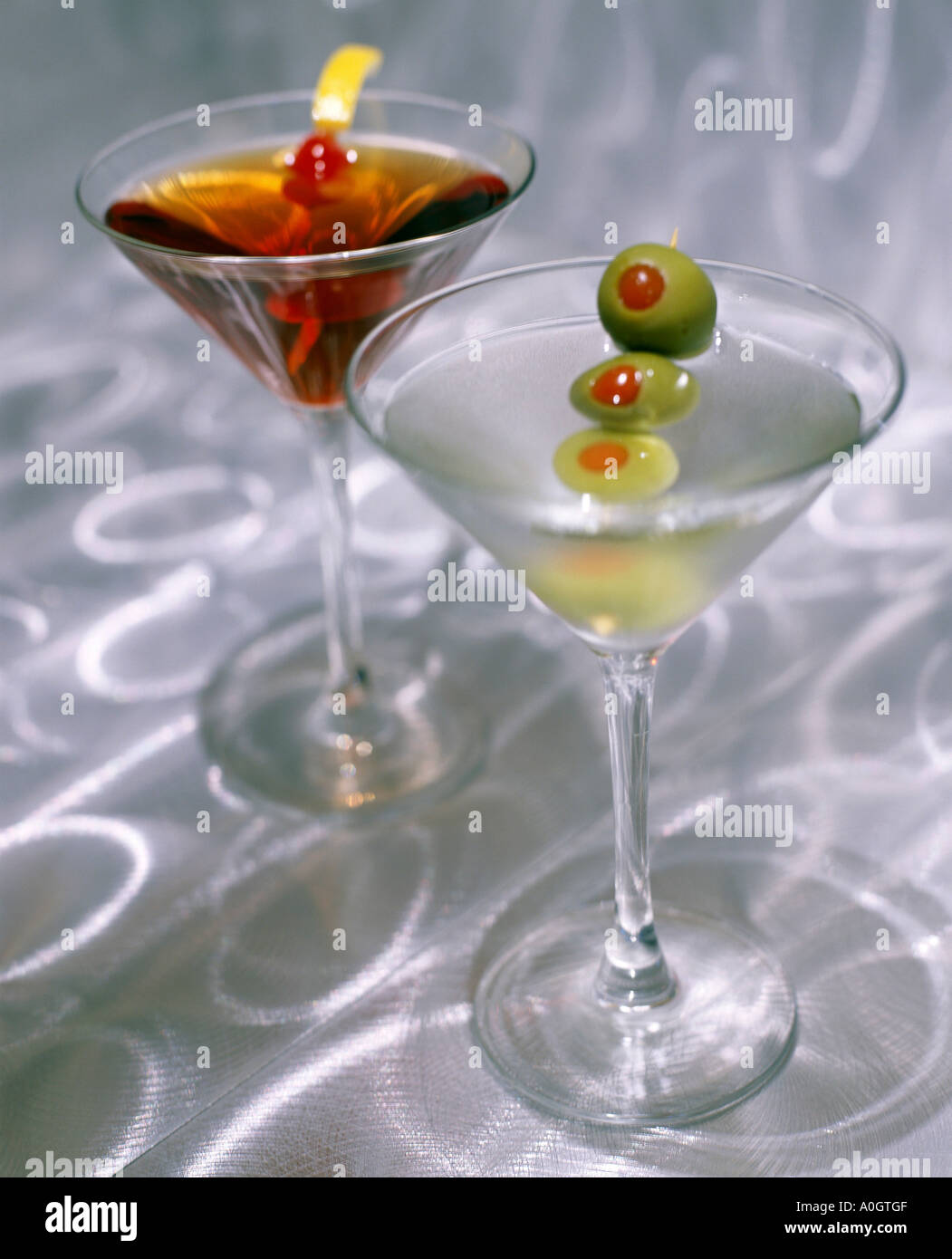 Green olives in martini glasses Stock Photo - Alamy