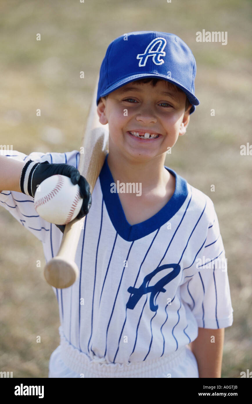 Portrait of a boy holding a baseball bat Stock Photo - Alamy
