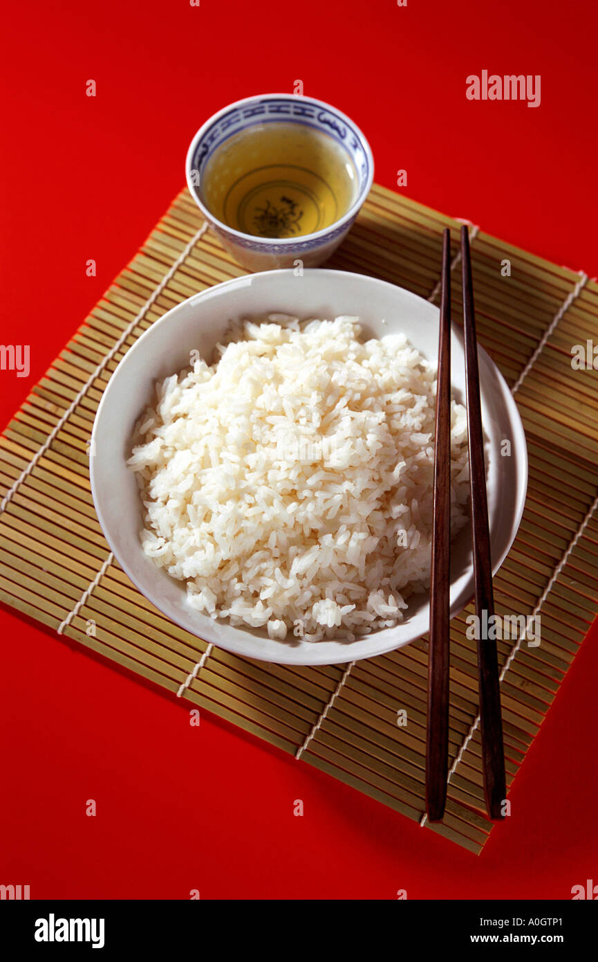 Bowl of rice with chopsticks Stock Photo - Alamy