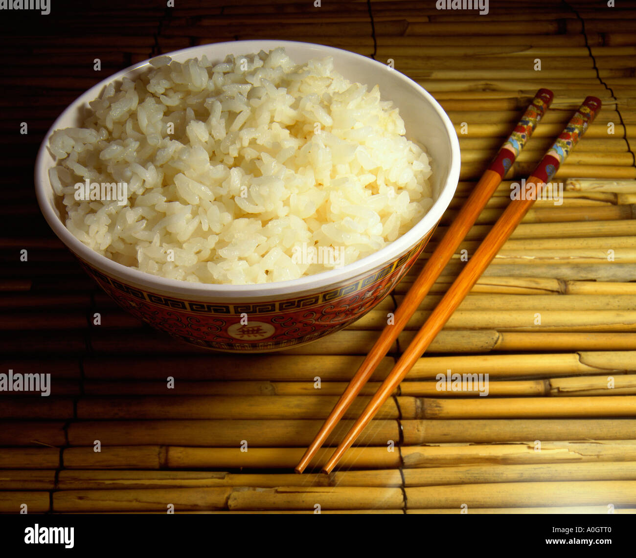 Bowl of rice with chopsticks Stock Photo - Alamy