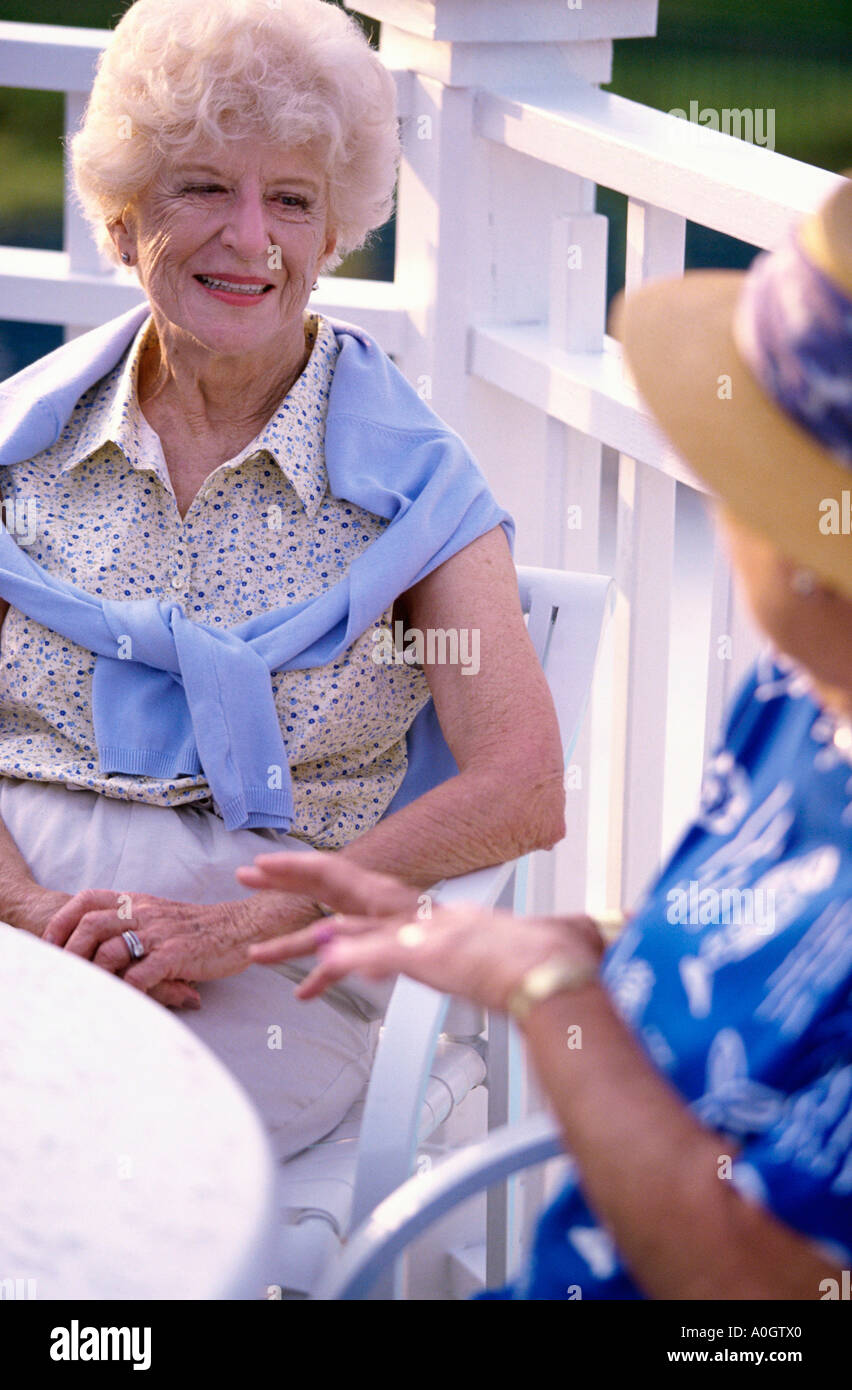 Two senior women talking Stock Photo - Alamy