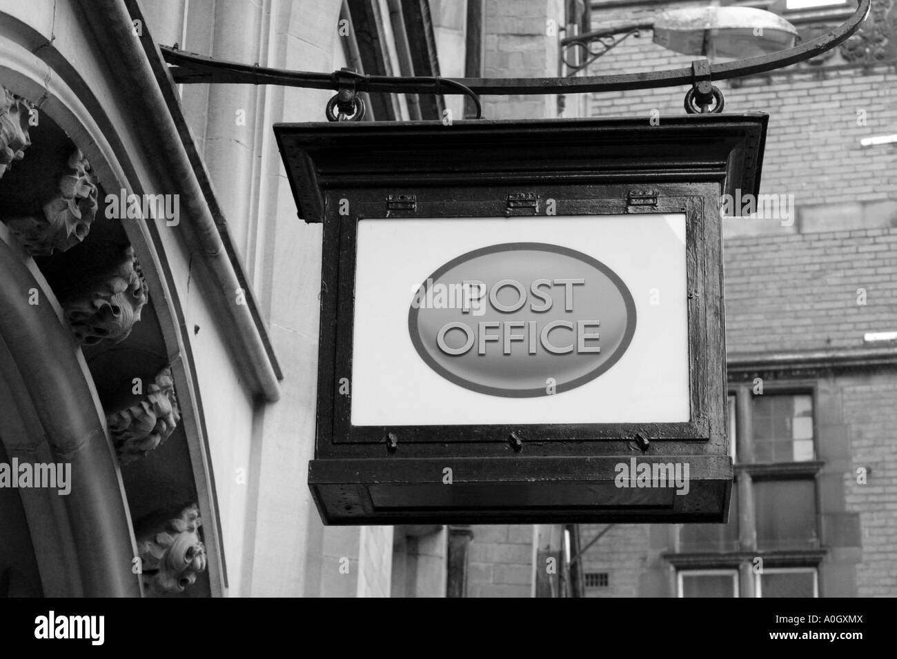 Red postage sign Black and White Stock Photos & Images - Alamy
