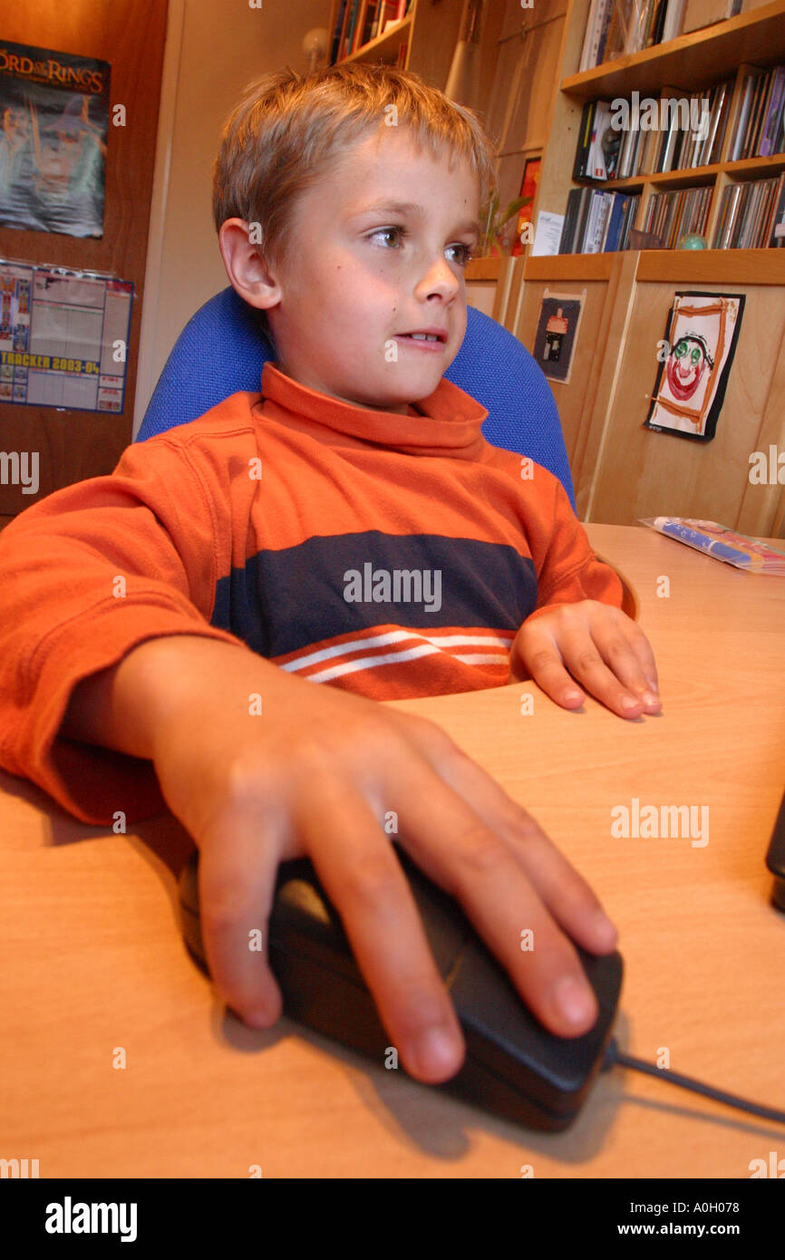 Young boy playing computer game on home computer Stock Photo - Alamy