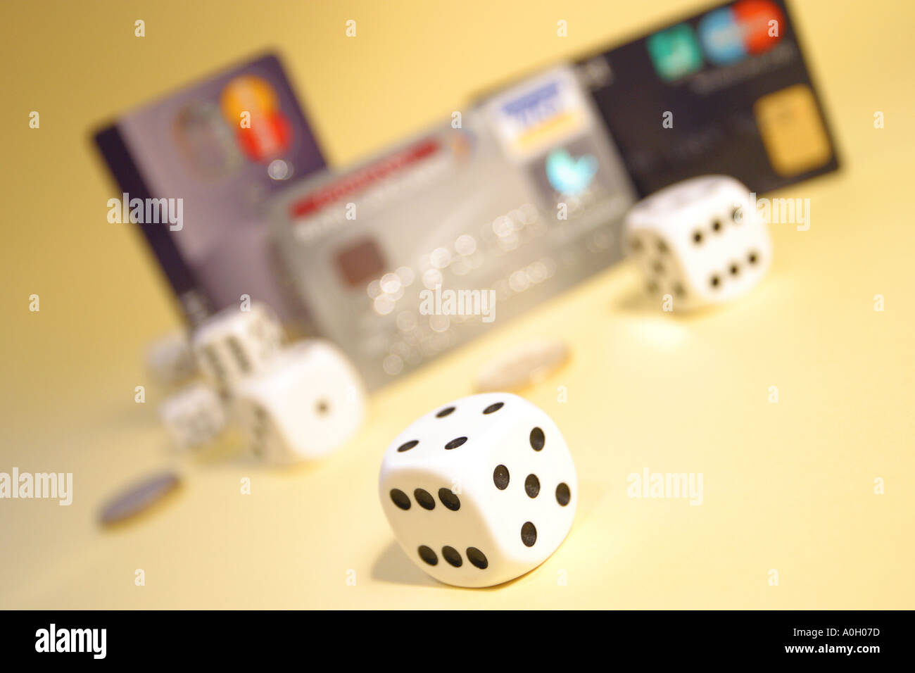 Financial gamble credit card money and dice Stock Photo - Alamy