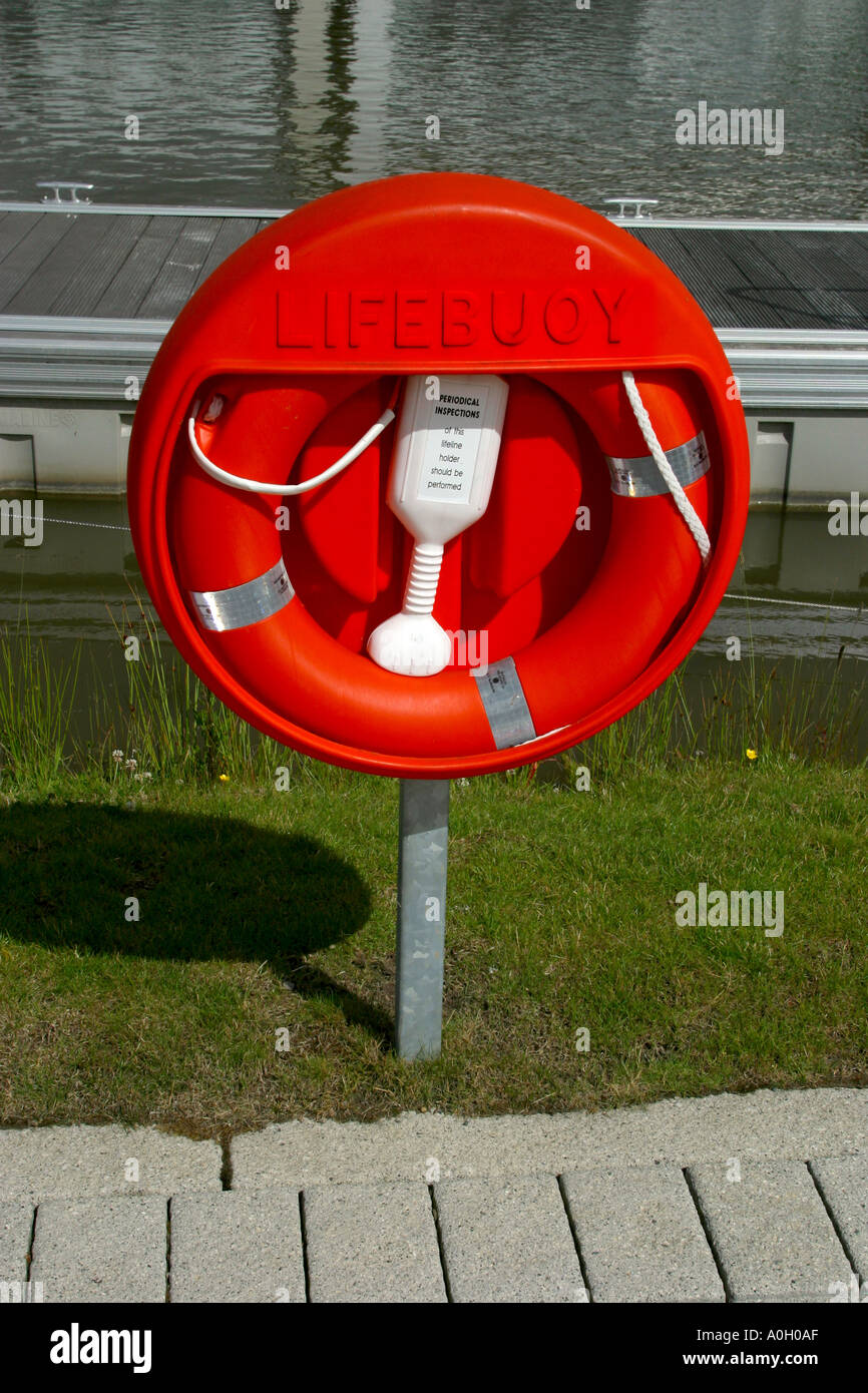 Lifebouy at waters edge Stock Photo - Alamy