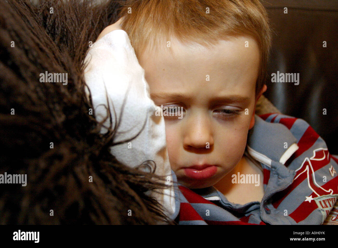 young boy sulking in a bad mood Stock Photo - Alamy