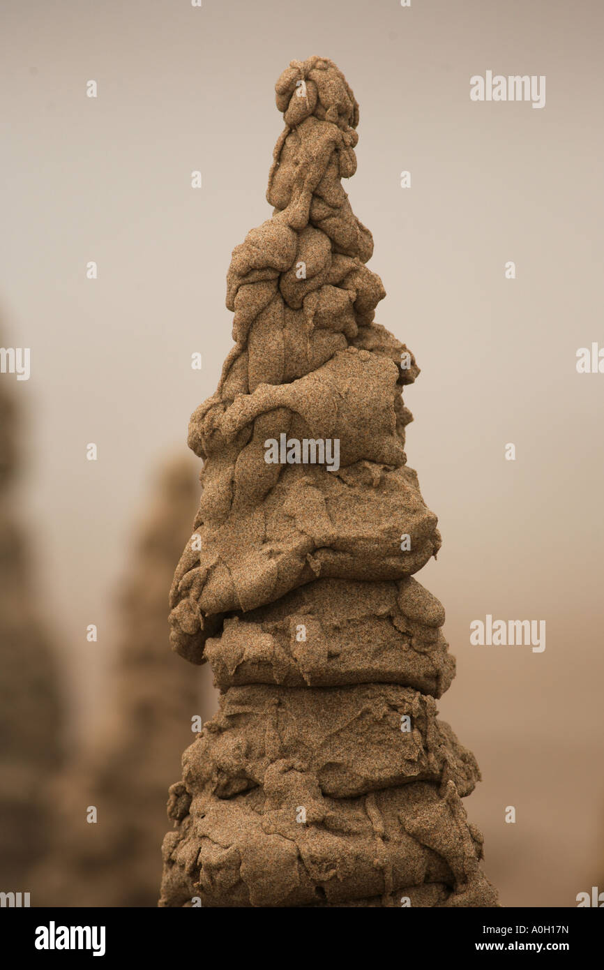 A drippy sand castle tower Stock Photo - Alamy