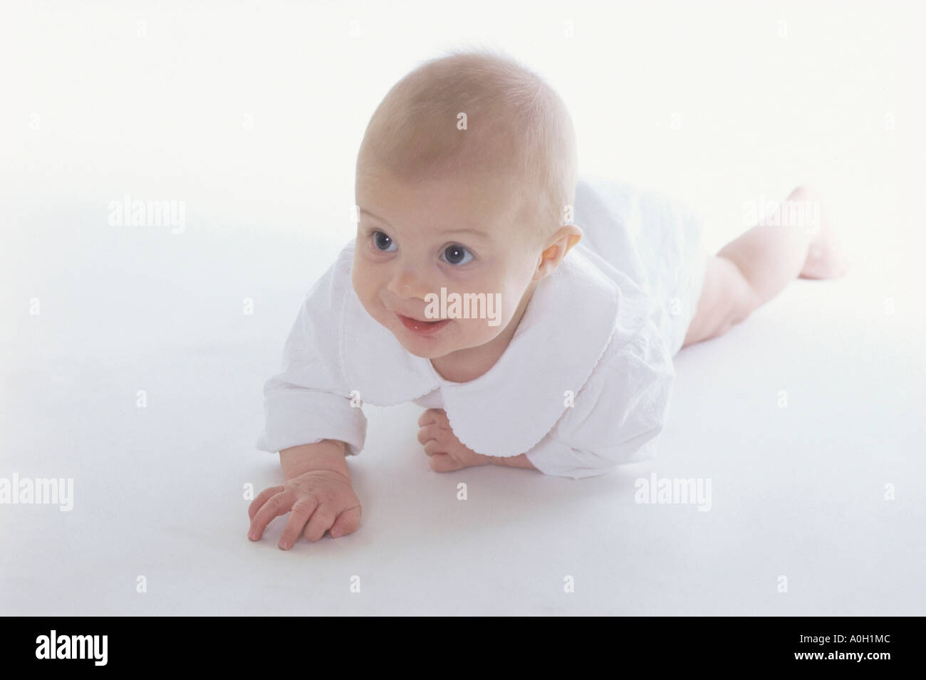 Baby crawling away on white hi-res stock photography and images - Alamy