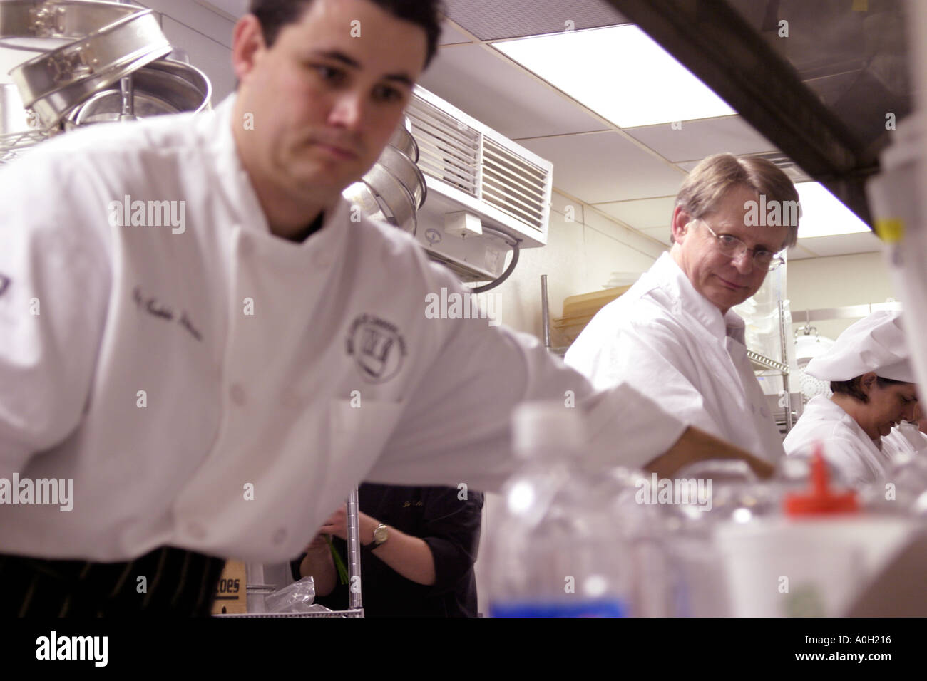 Chefs on Cooking Line Stock Photo - Alamy