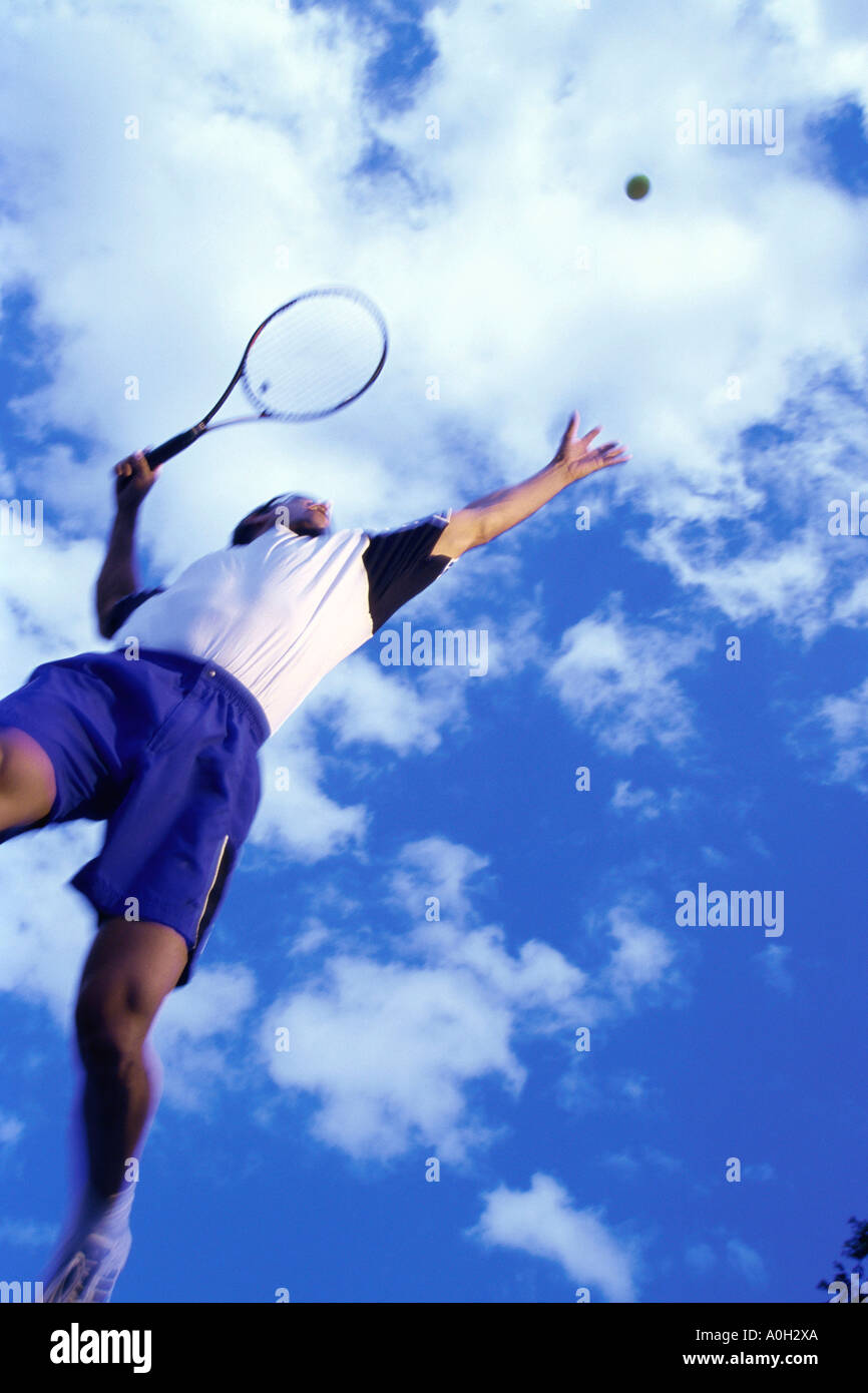 Man tennis blue sky action ball hi-res stock photography and images - Alamy
