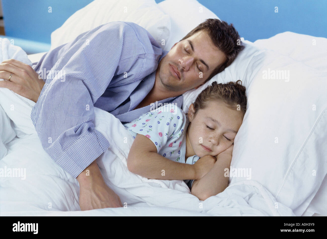 Girl sleeping with her father Stock Photo - Alamy