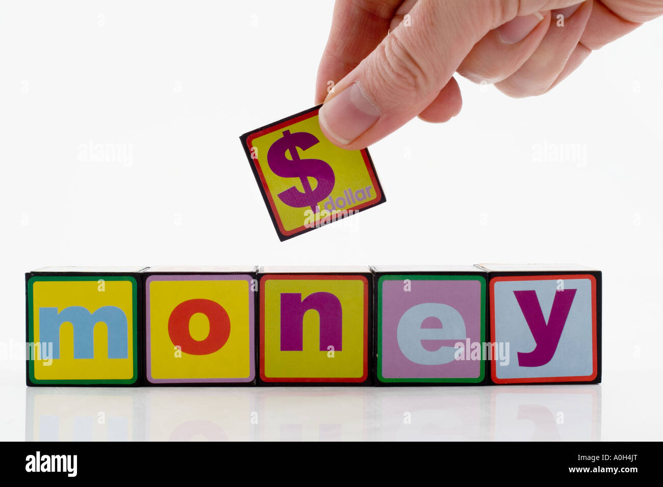 toy building blocks with the word money and the dollar symbol Stock ...