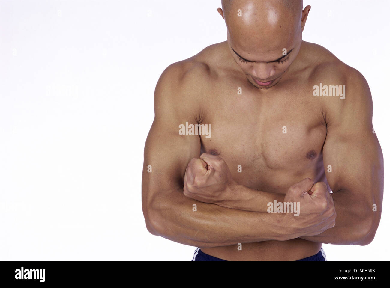 Young man flexing his biceps Stock Photo - Alamy Young man flexing his biceps Stock Photo - Alamy