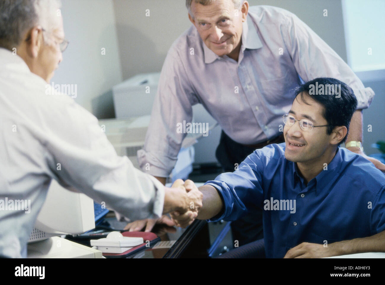 Three businessmen in an office Stock Photo - Alamy