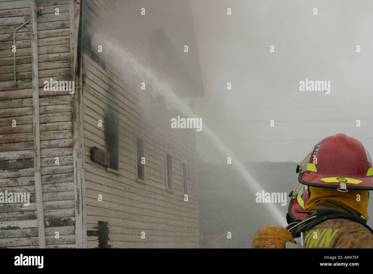 Firefighter fighting Barn Fire Stock Photo - Alamy