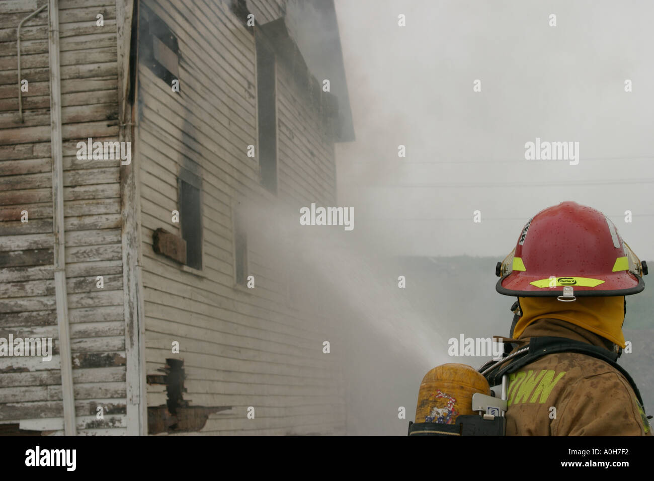 Firefighter fighting Barn Fire Stock Photo - Alamy
