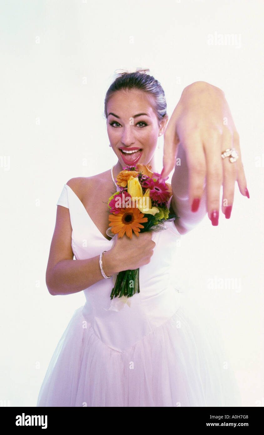 Portrait of a bride showing her wedding ring Stock Photo - Alamy