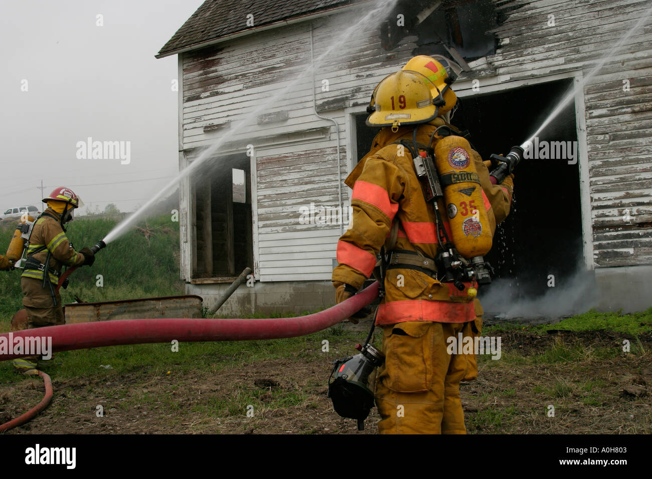 Firefighters Fighting Barn Fire Stock Photo - Alamy