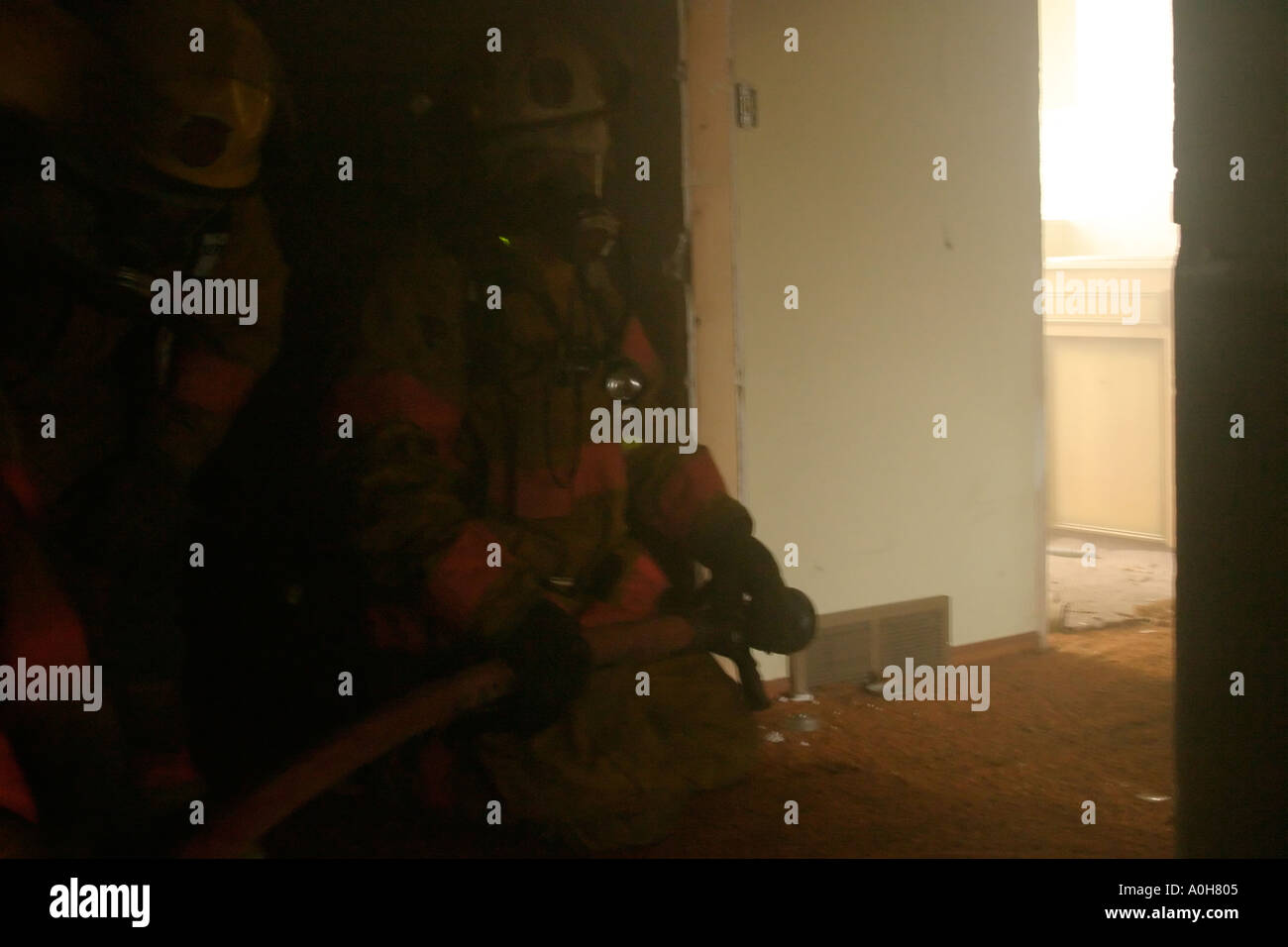 Firefighters inside Burning House Stock Photo - Alamy