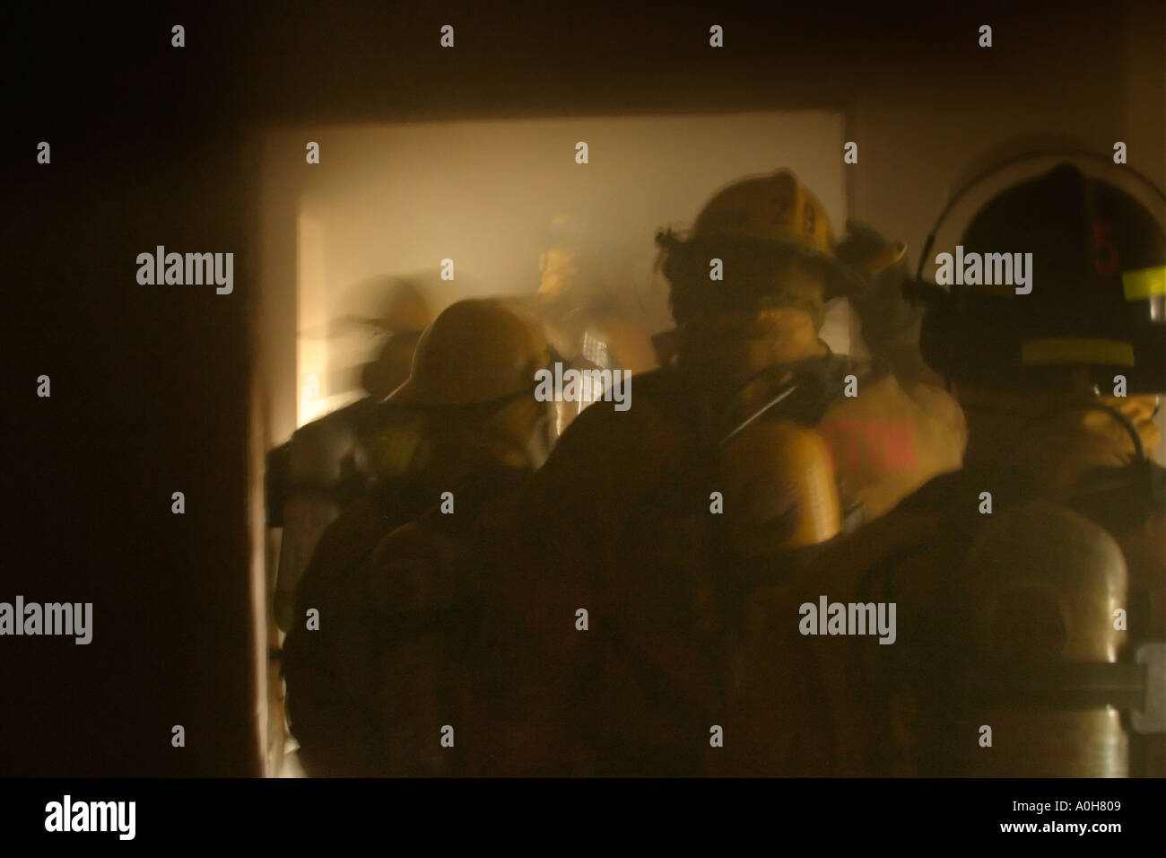 Firefighters inside Burning House Stock Photo - Alamy