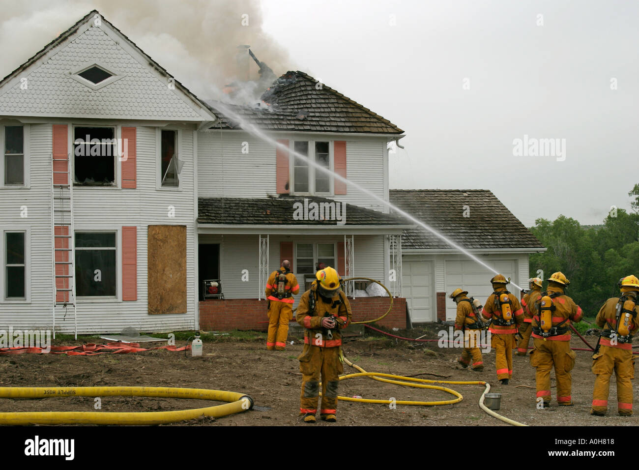Firefighters making Exterior Attack Stock Photo - Alamy