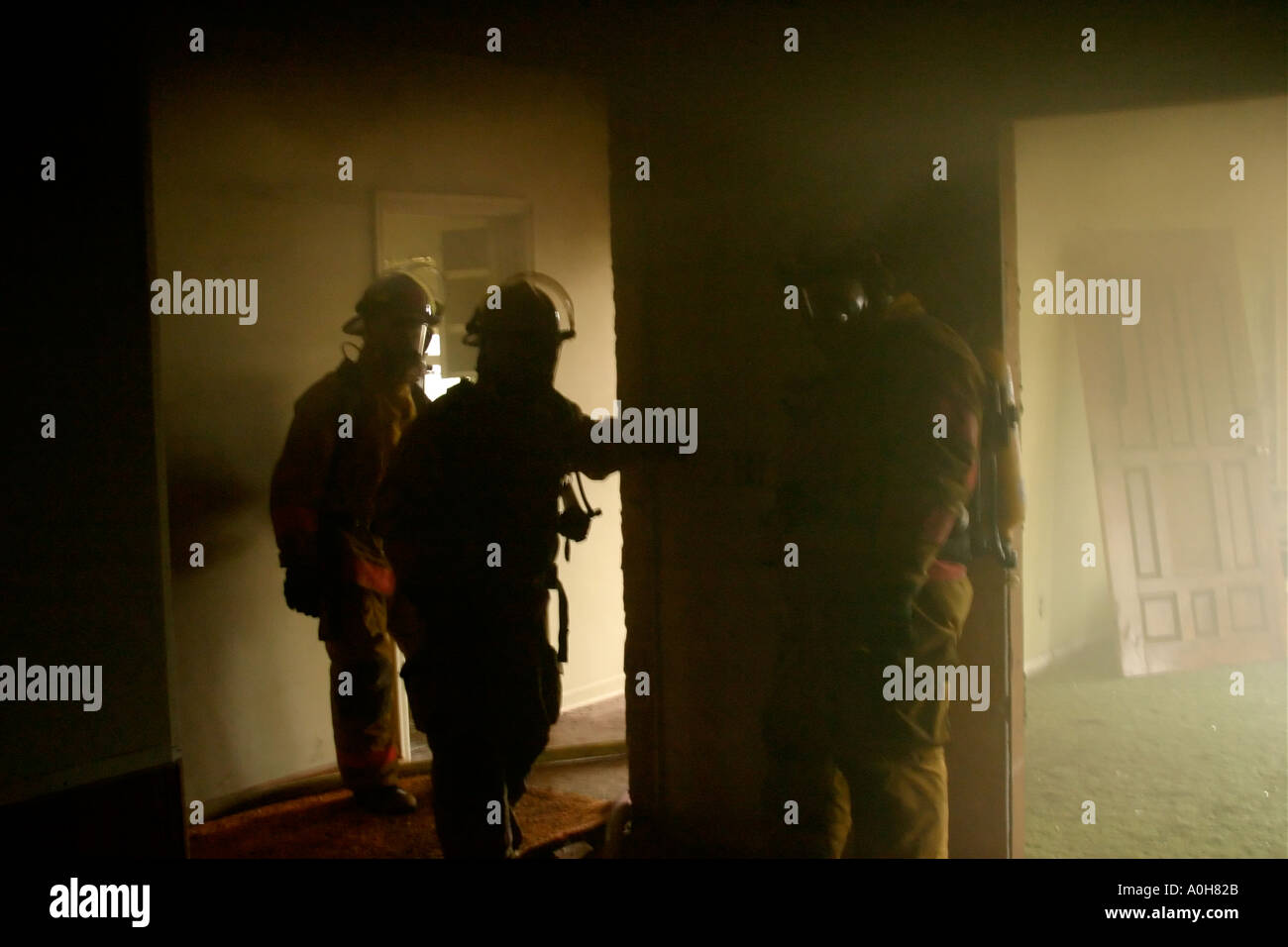 Firefighters inside Burning House Stock Photo - Alamy