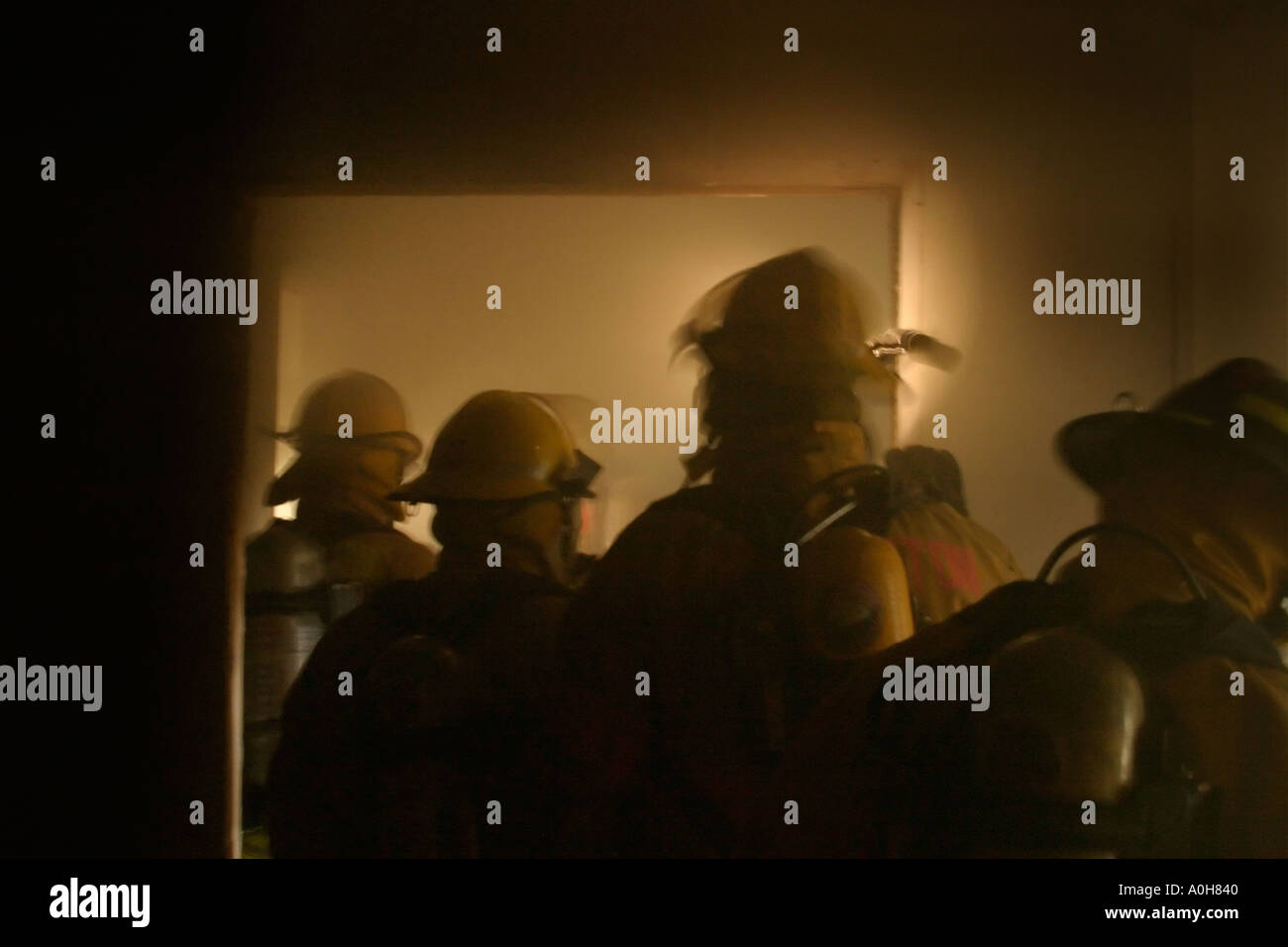 Firefighters inside Burning House Stock Photo - Alamy