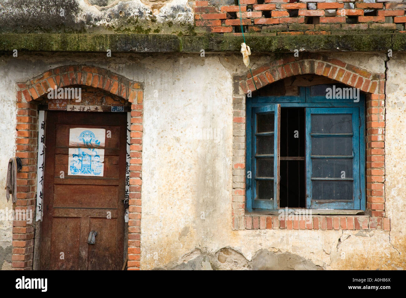 Door, entryway, window, and bricks on house in Xinjie village, Yuanyang, Yunnan, China Stock ...