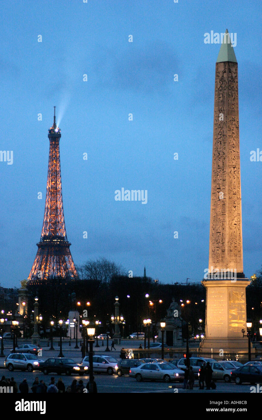 Light beam shines from Eiffel Tower towards obelisk in the Place de la ...