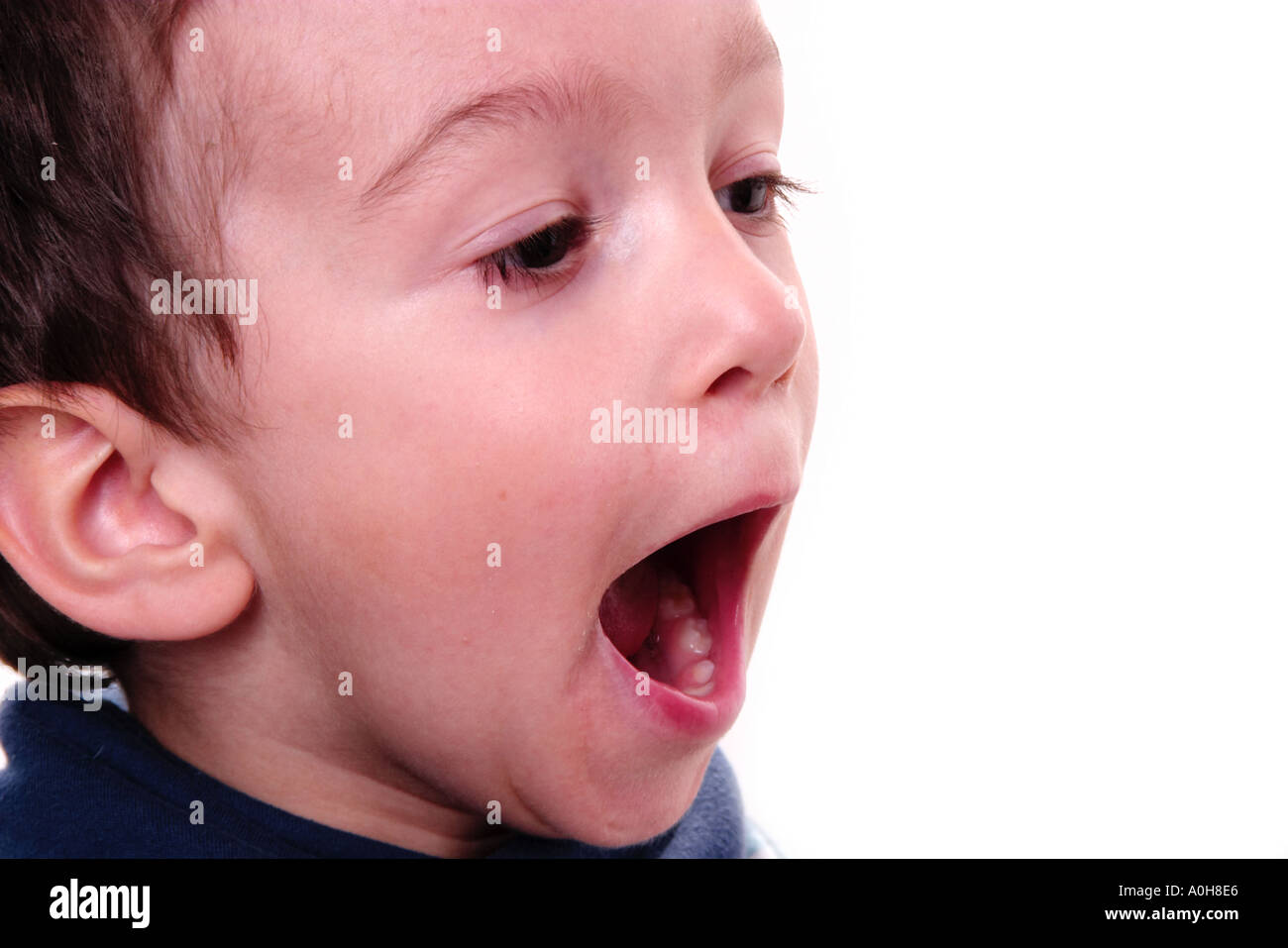 Little boy yawning Stock Photo - Alamy