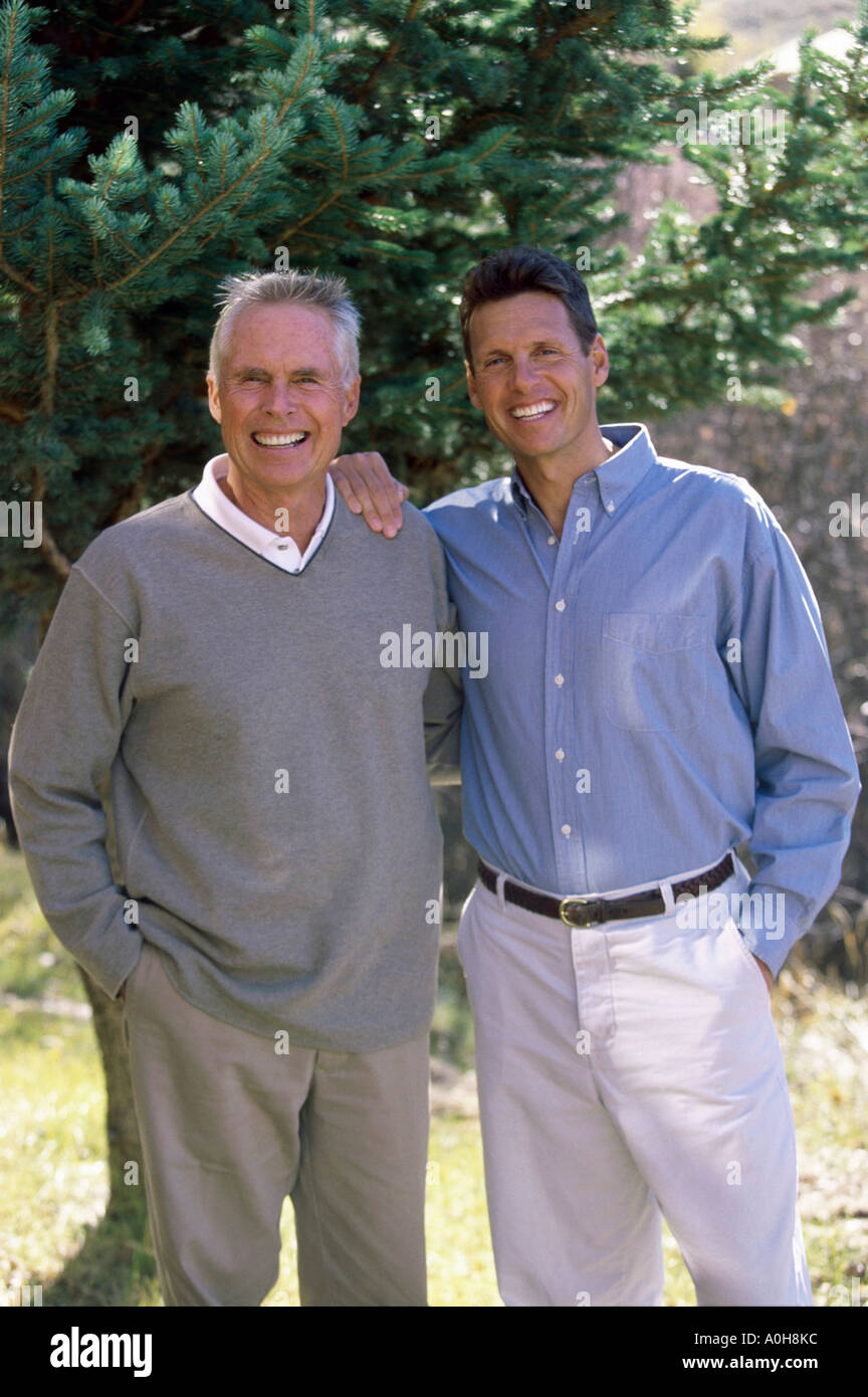 Portrait of a father standing with his son Stock Photo - Alamy