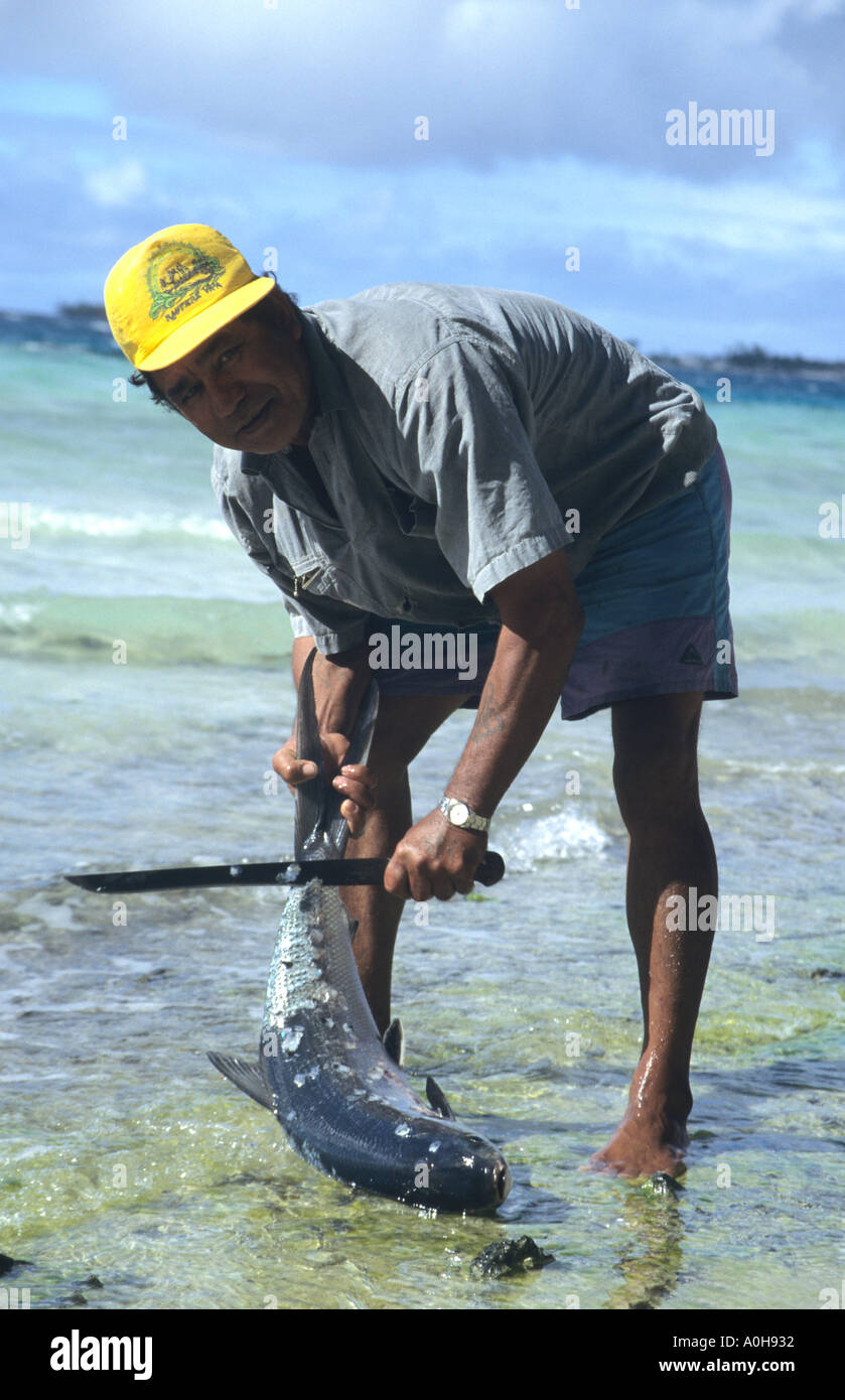 Fisherman cleaning his catch on a South Sea Island,South Pacific Stock ...