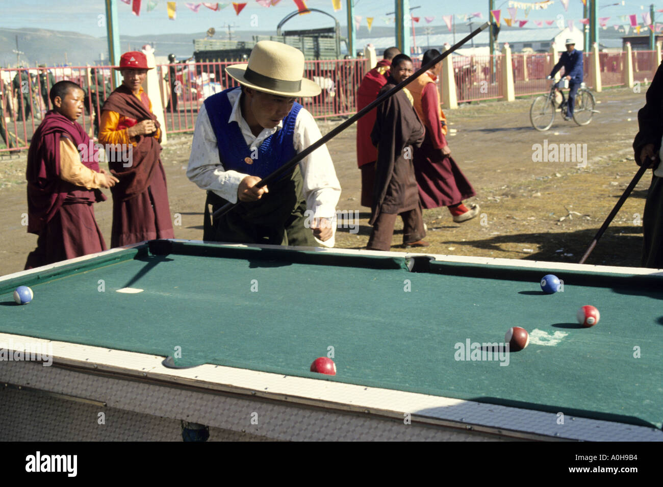 Man playing pool in an open field at Lhasa ,Tibet Stock Photo - Alamy