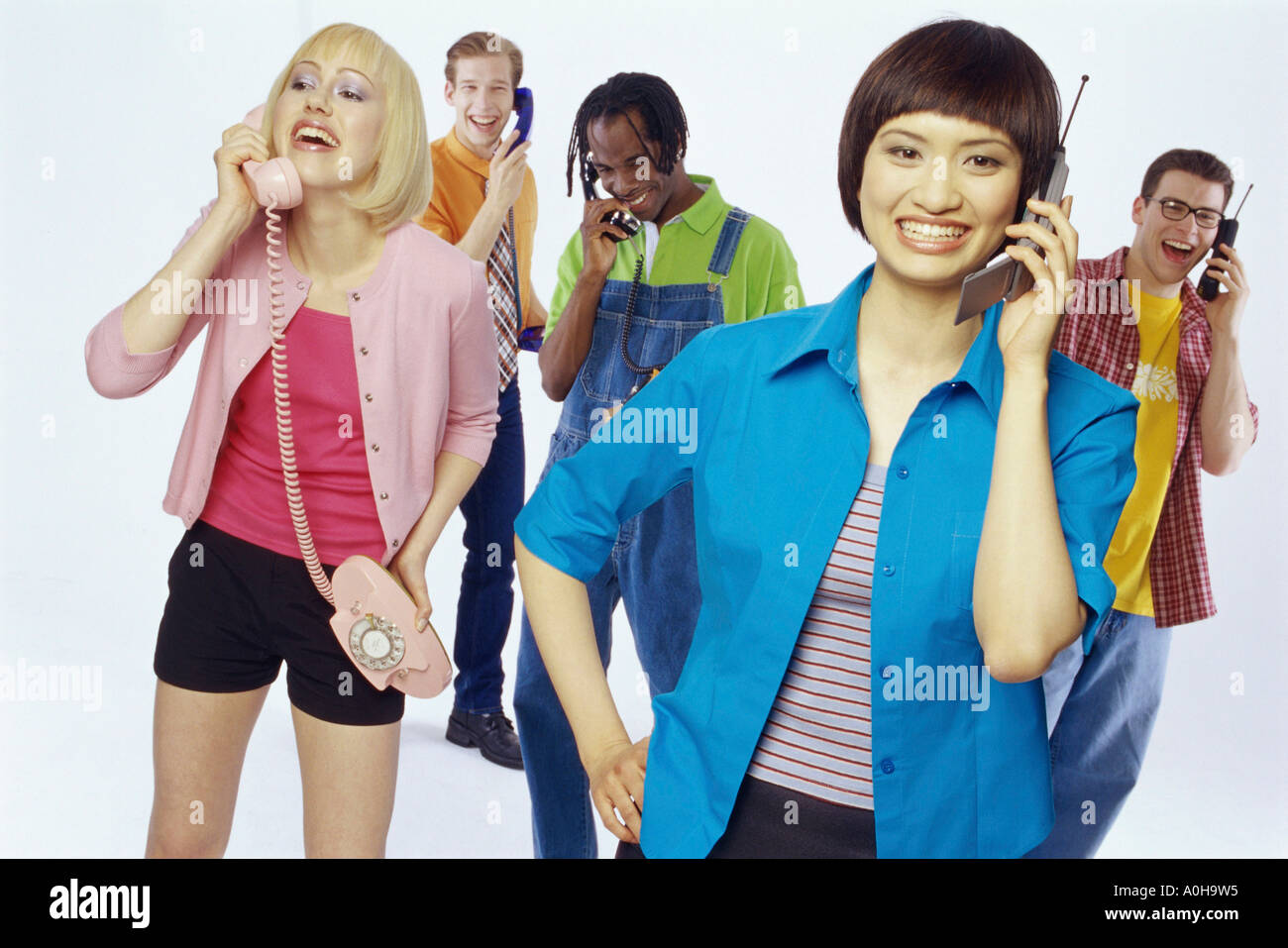 Group of young people talking on telephones Stock Photo - Alamy