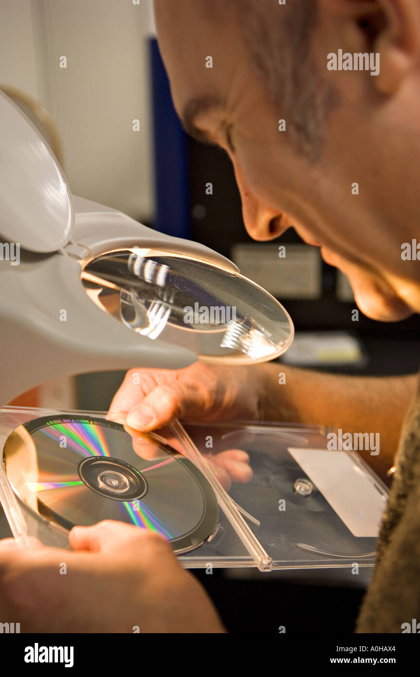 Inspecting a CD DVD stamper Stock Photo - Alamy