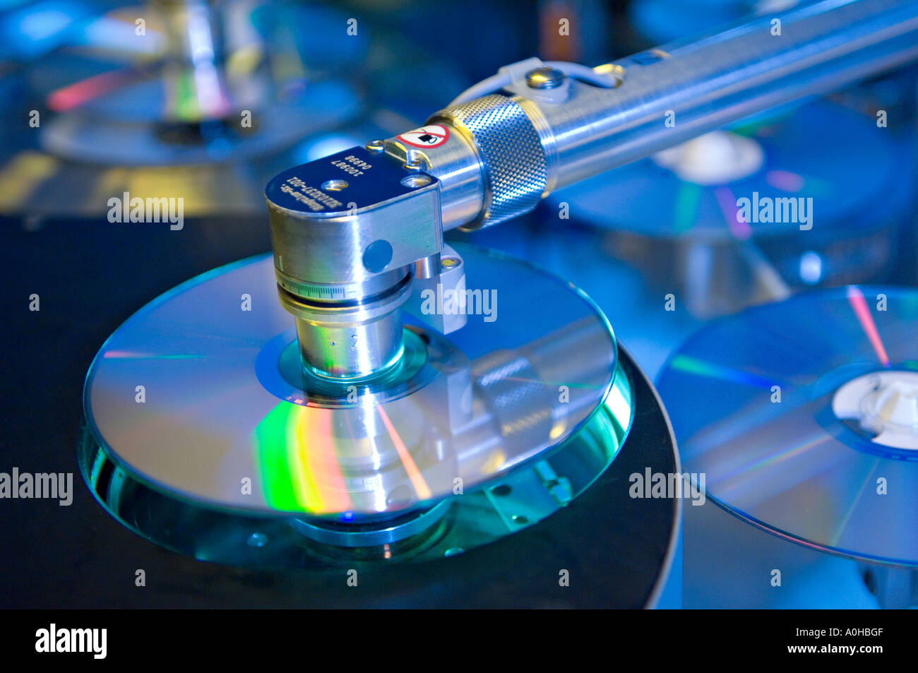 Reflective coating being applied to DVDs Stock Photo - Alamy