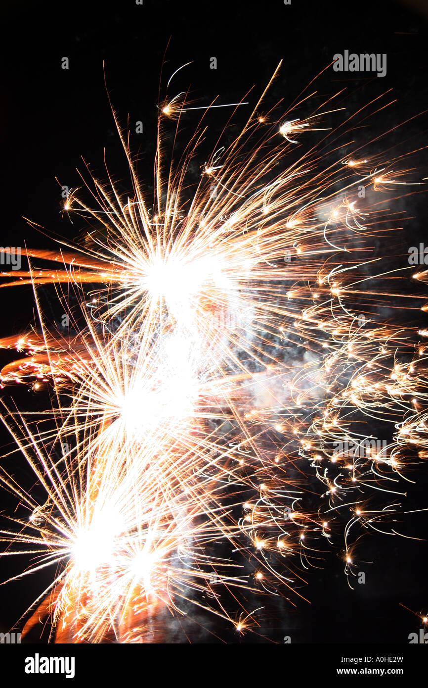 golden fireworks exploding in the night sky Stock Photo - Alamy