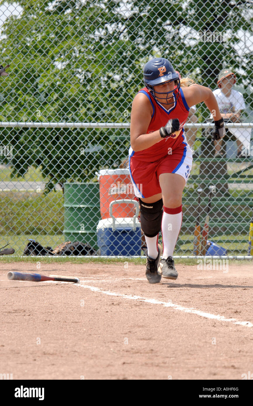 Teenage female Major league Softball action Stock Photo - Alamy