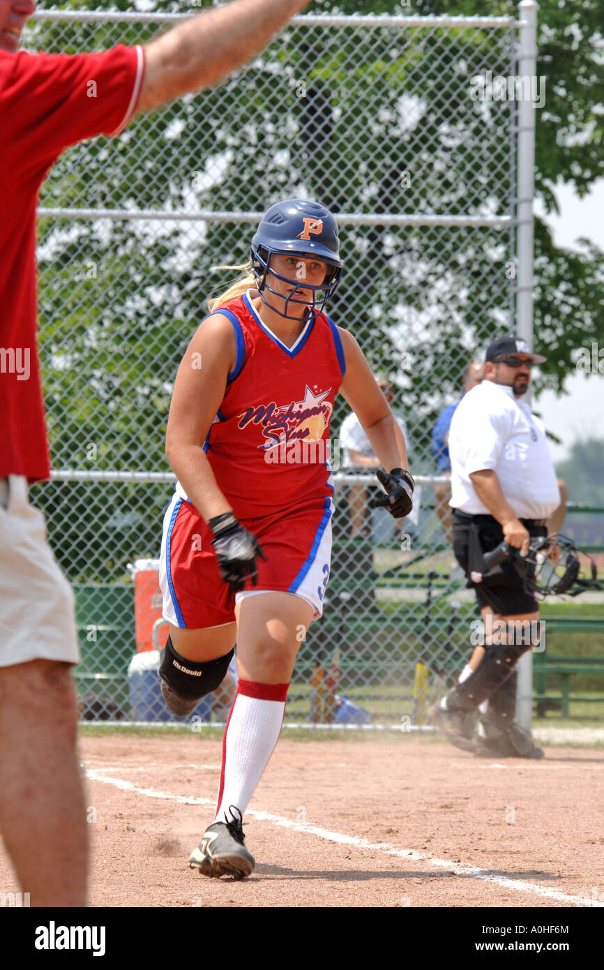 Teenage female Major league Softball action Stock Photo - Alamy