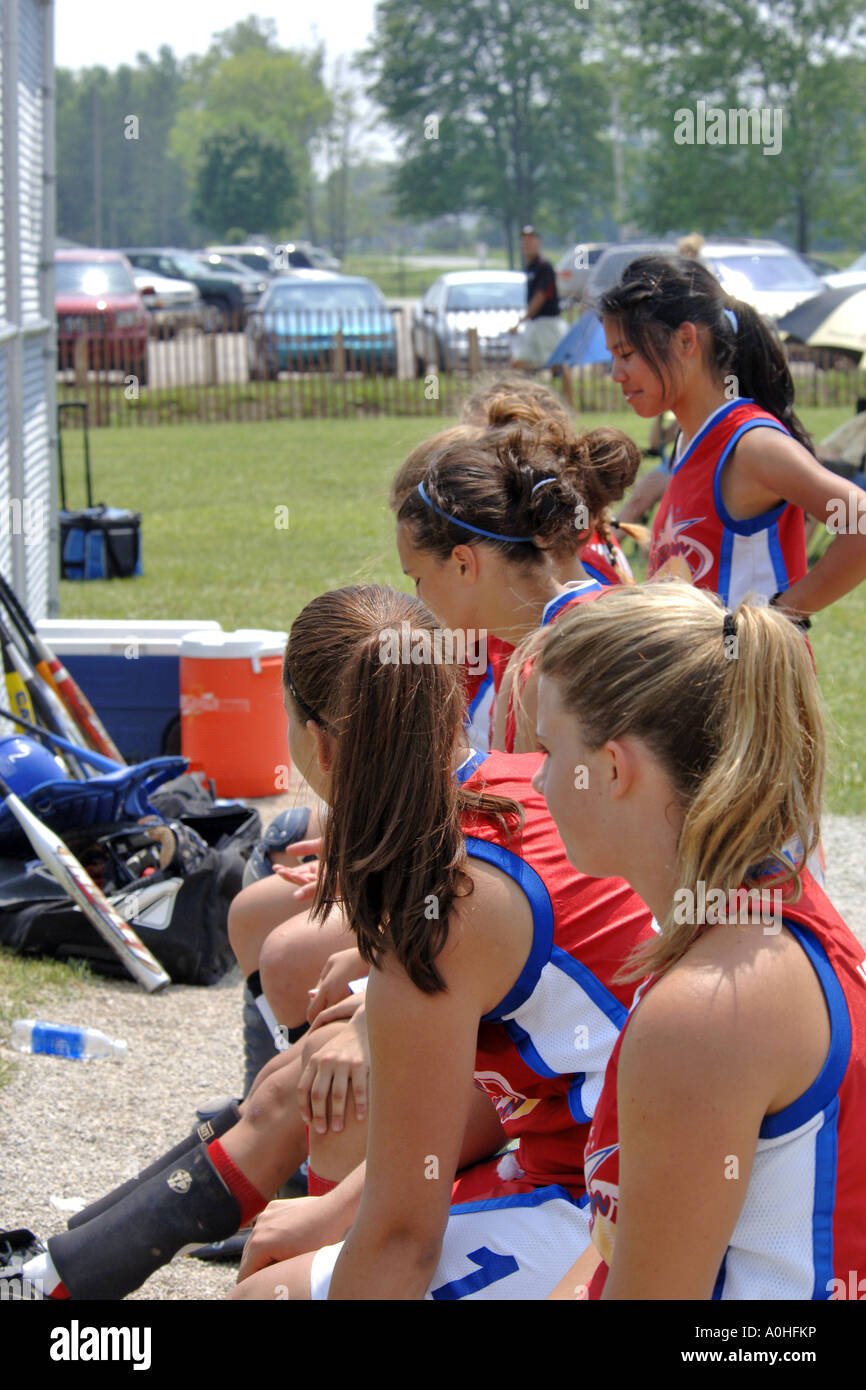 Teenage female Major league Softball players sitting on the bench Stock ...