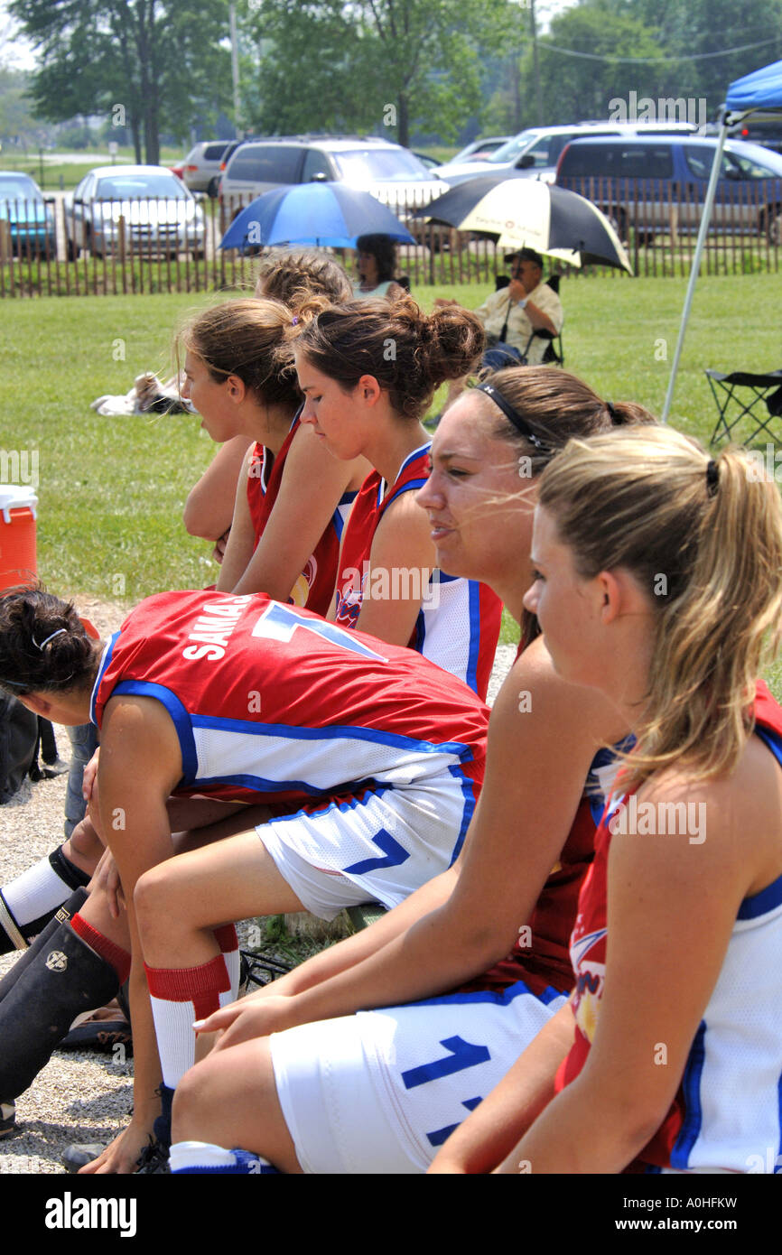 Teenage female Major league Softball players sitting on the bench Stock ...