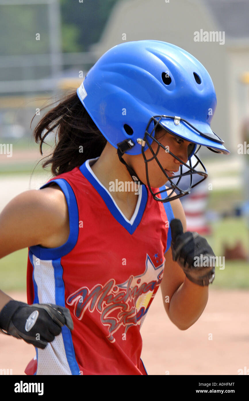 A teenage female Major League Softball player wearing a helmet Stock ...