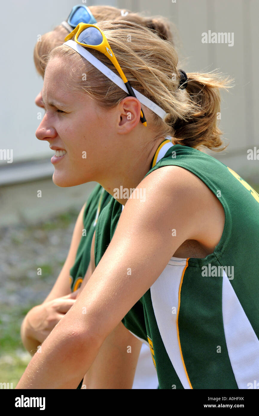Teenage female major league Softball players sitting on the bench Stock ...