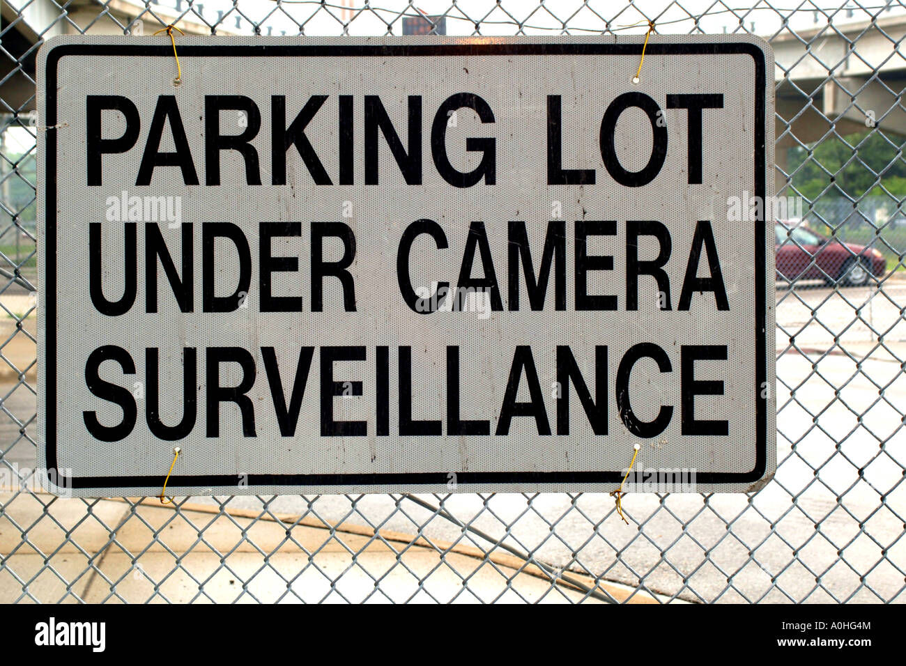 Under camera surveillance Parking Lot sign Stock Photo - Alamy