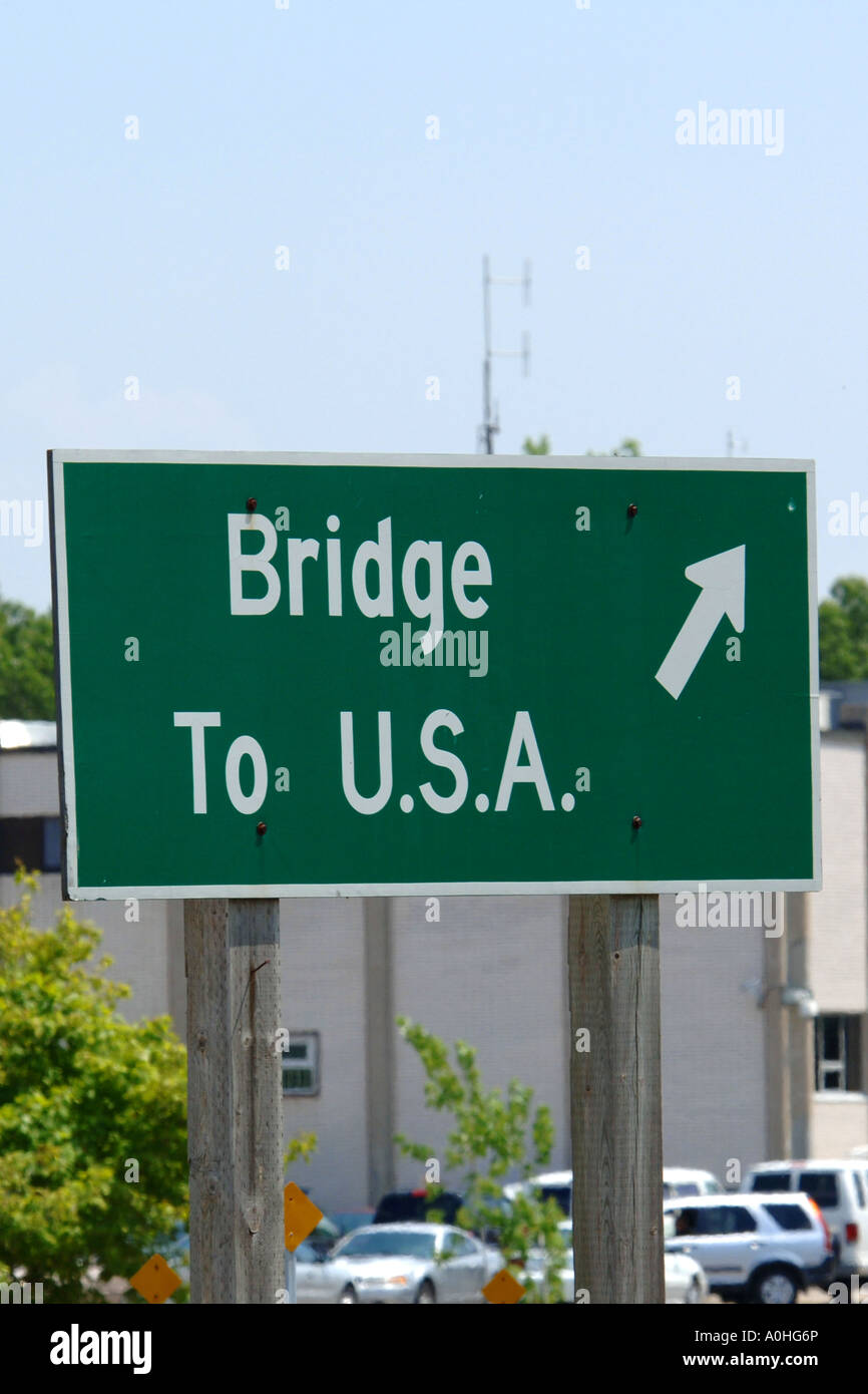 Direction sign "Bridge to U S A" seen in Canada Stock Photo - Alamy