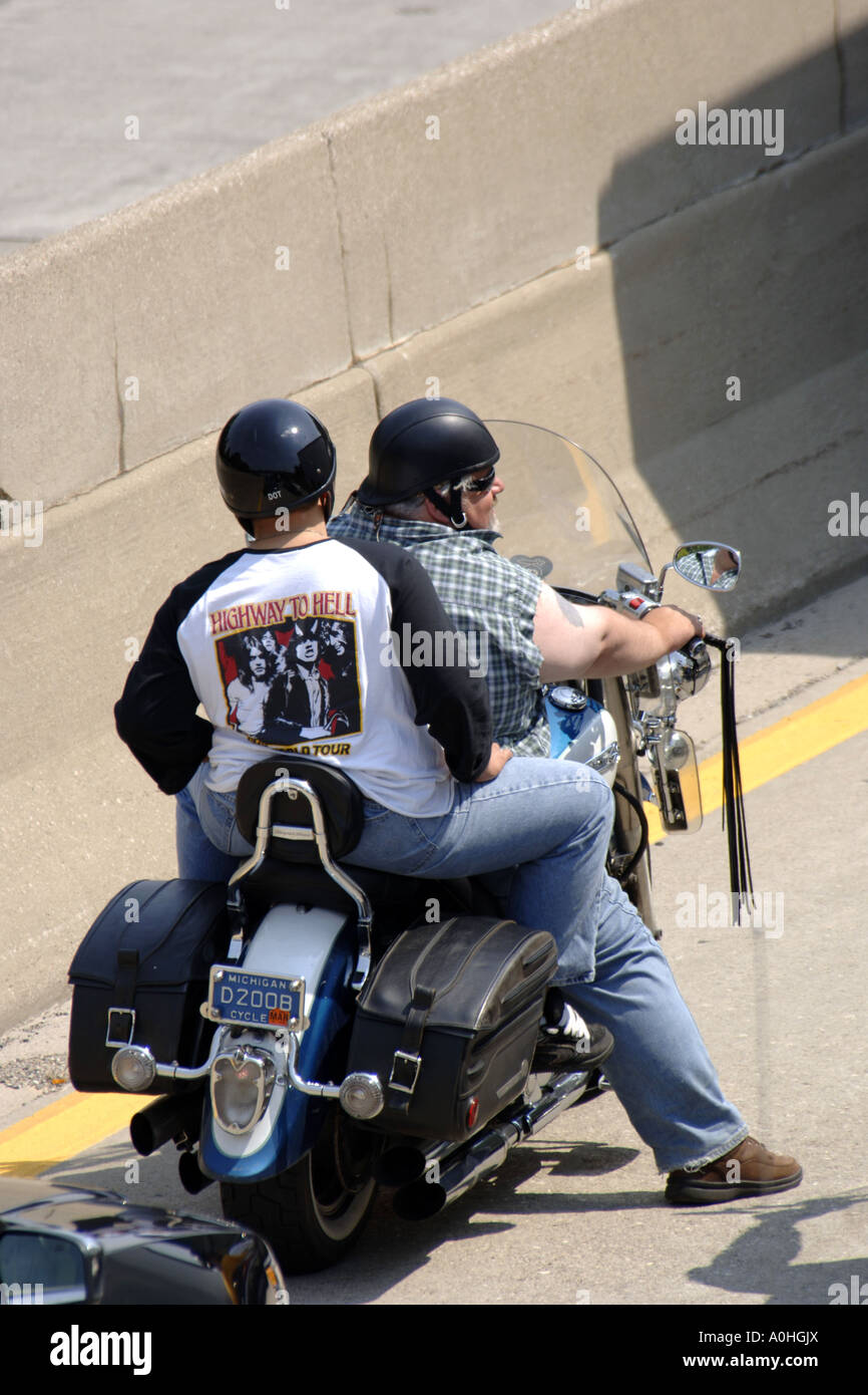 Harley Davidson motorcycle in a traffic jam, the riders inhaling ...